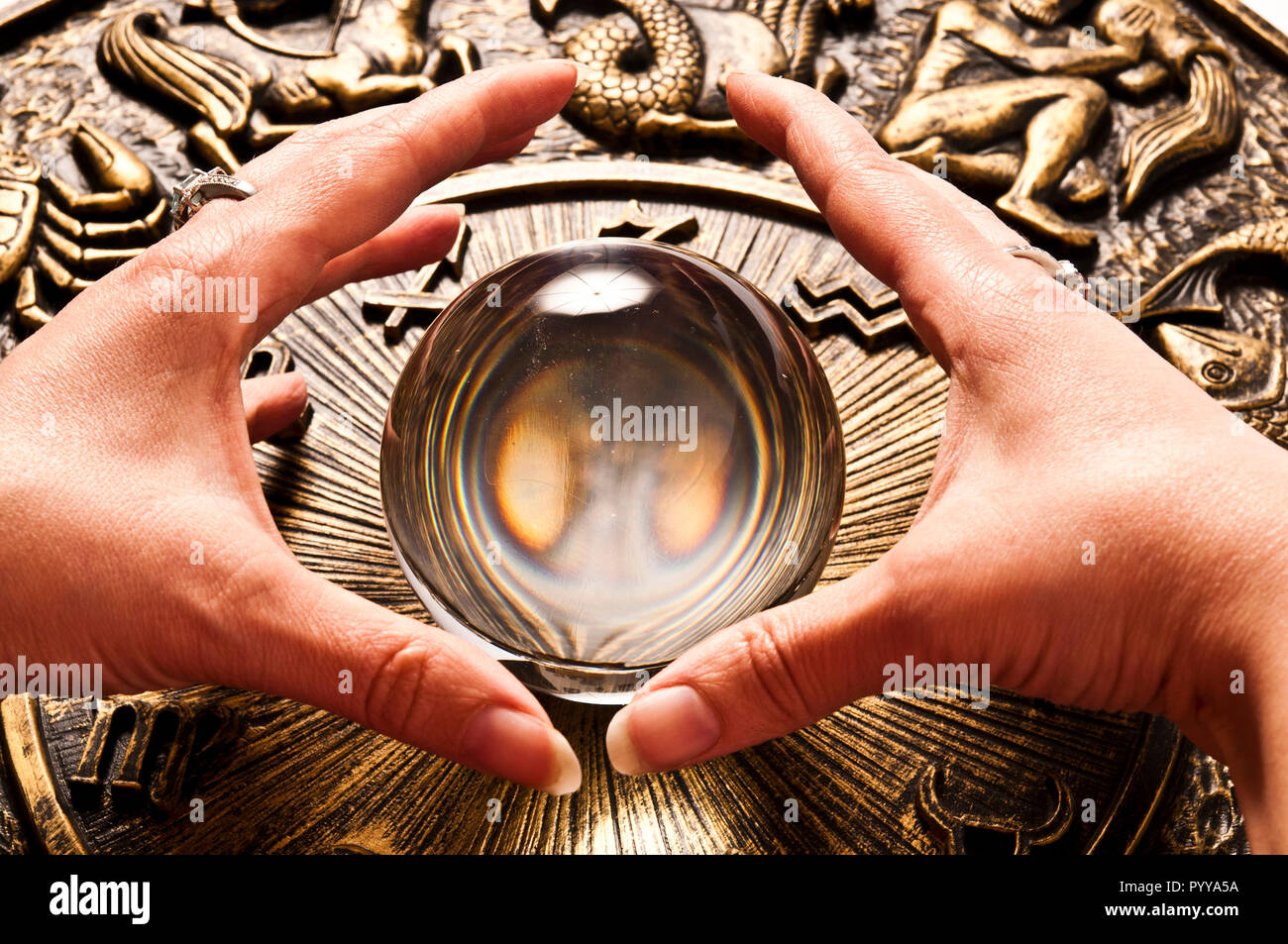 fortune teller hands and magic sphere for divination Stock Photo - Alamy