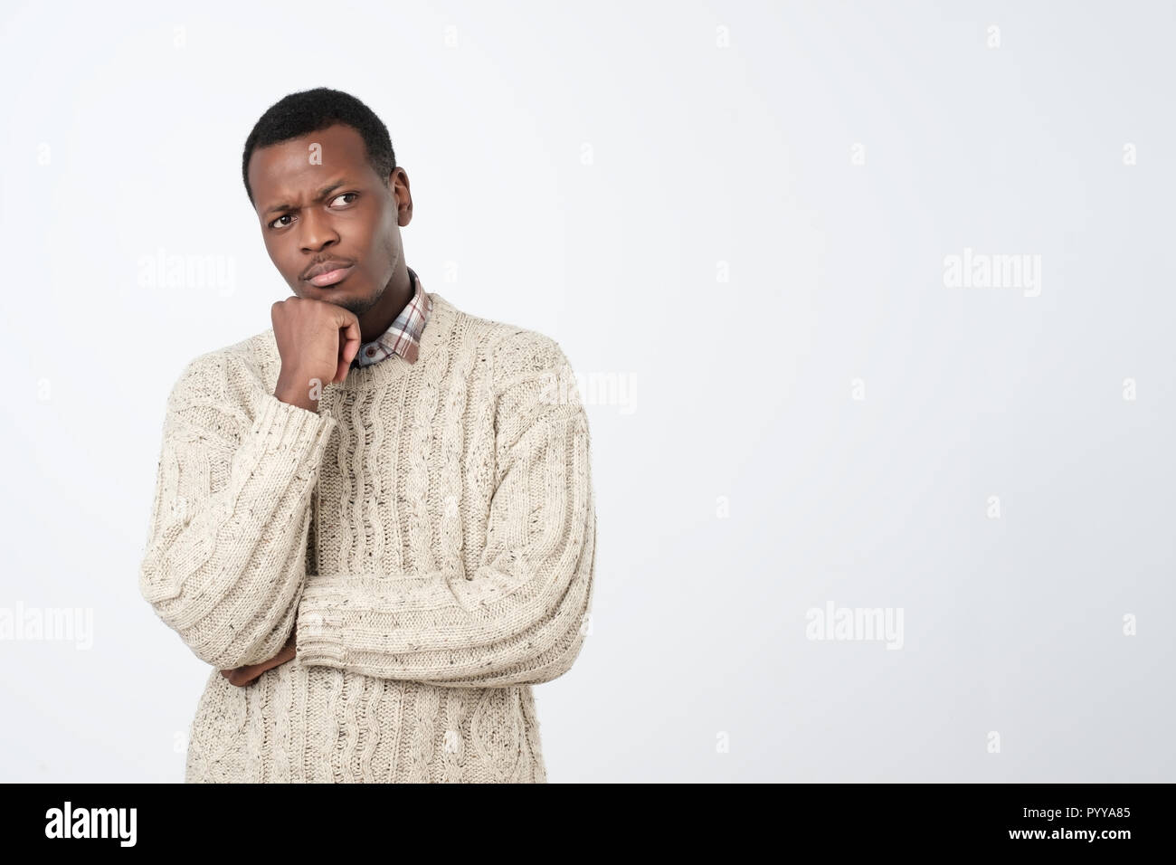 African young man trying to make an important decision Stock Photo - Alamy