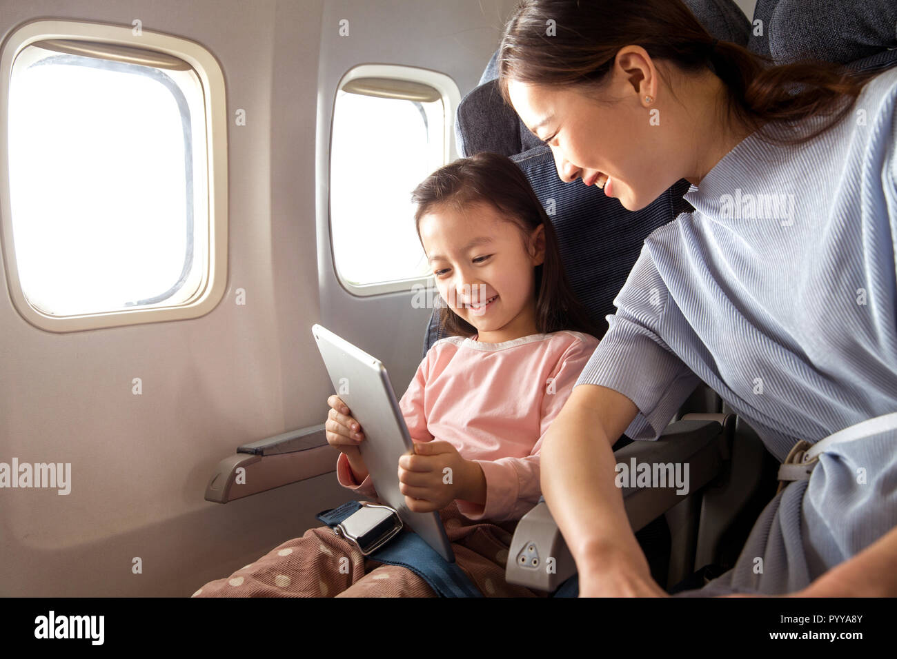 Family airplane passenger hi-res stock photography and images - Alamy