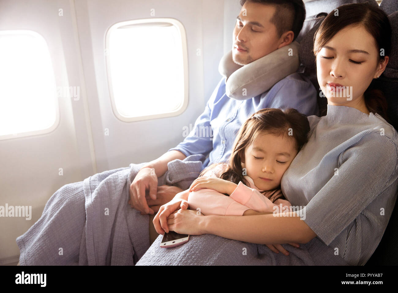 Happy families by plane Stock Photo - Alamy