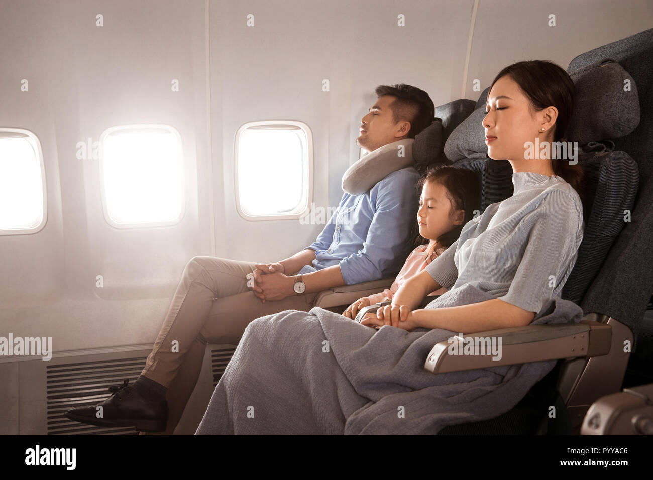 Happy families by plane Stock Photo - Alamy