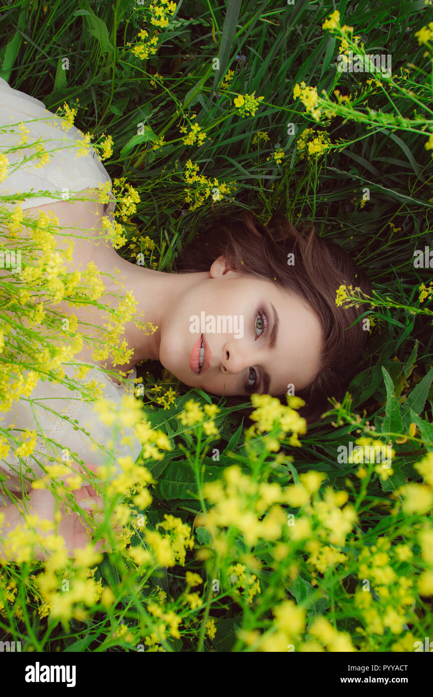 Girl Laying In Flowers