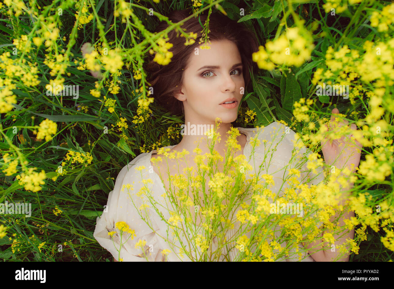 Woman laying flowers hi-res stock photography and images - Alamy