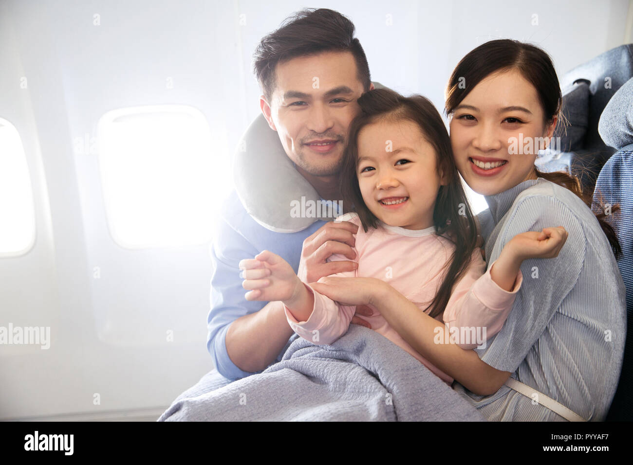 Happy families by plane Stock Photo - Alamy