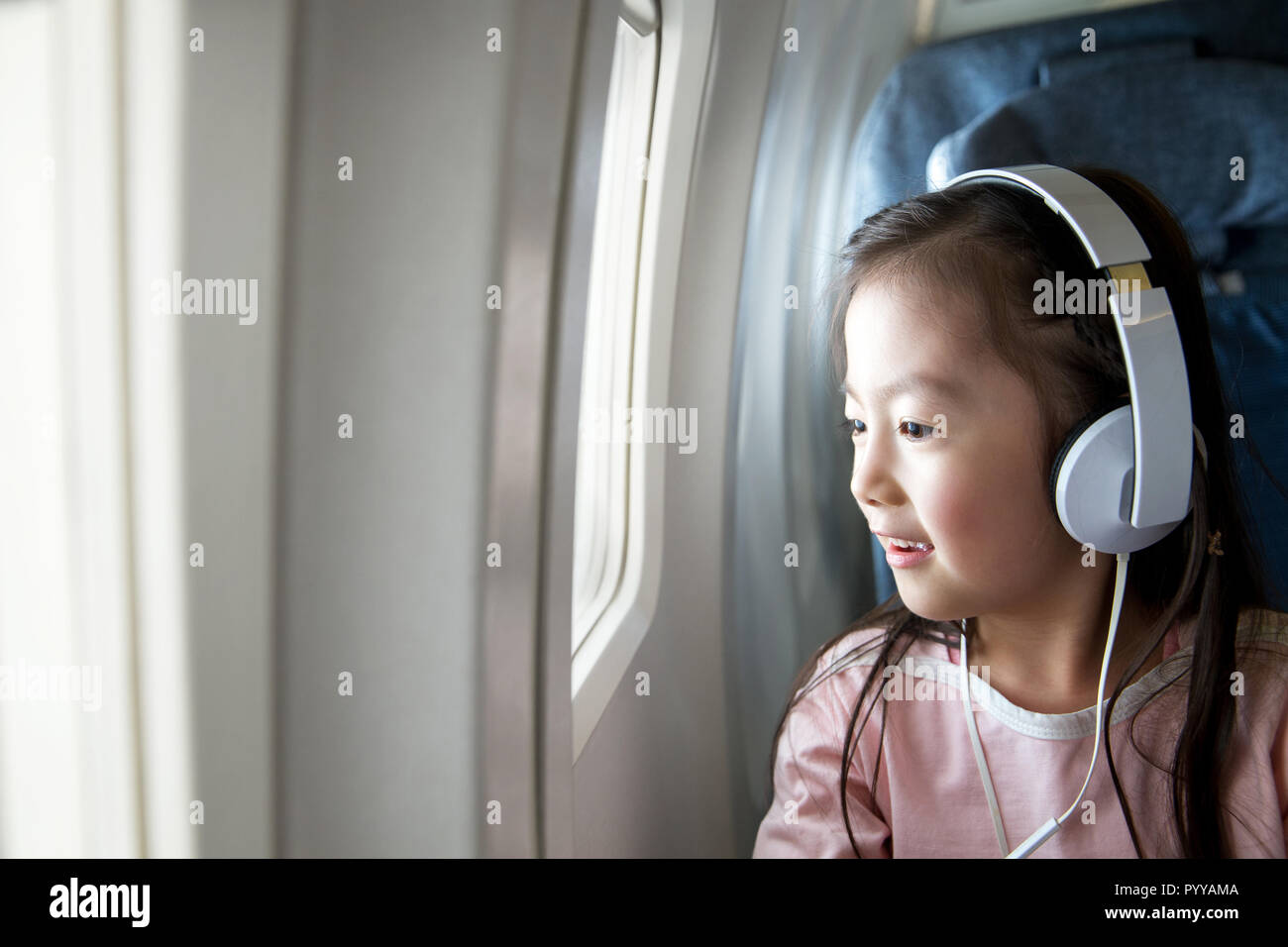 Cute girl on the plane Stock Photo - Alamy