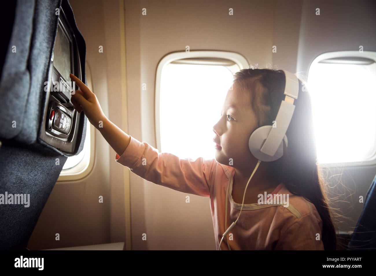 Cute girl on the plane Stock Photo - Alamy