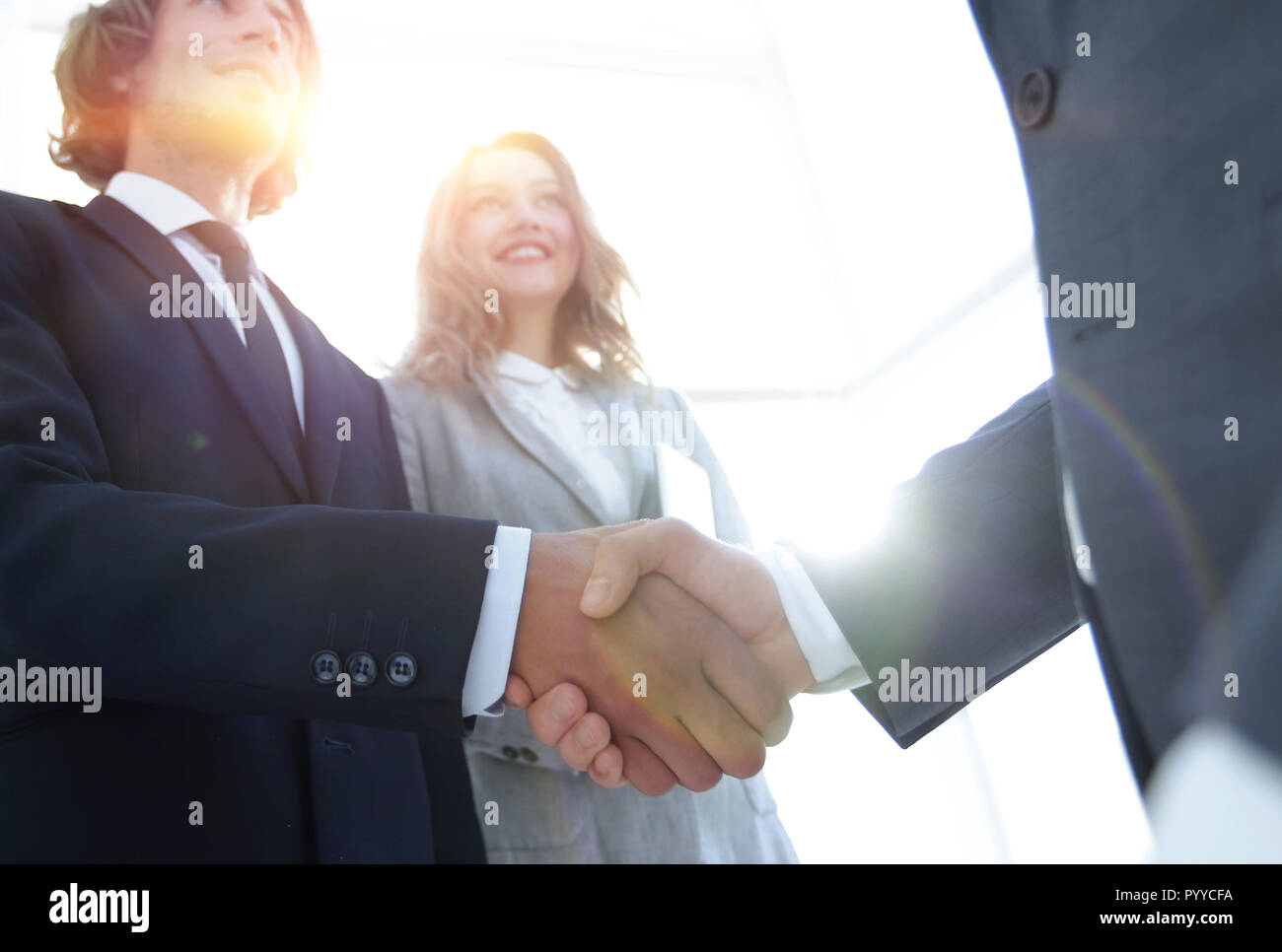 Photo of handshake of two happy businessmen Stock Photo - Alamy
