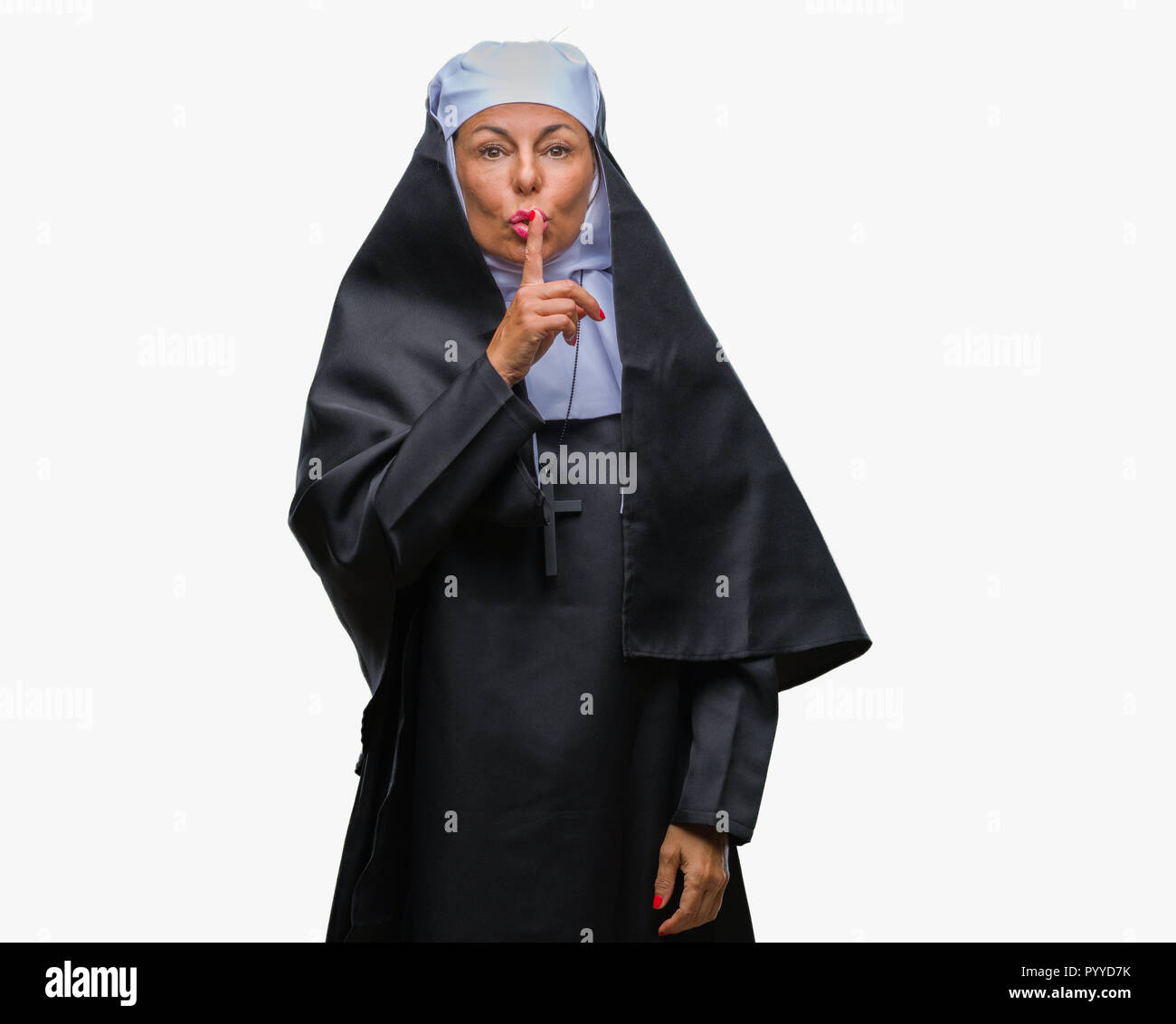 Middle age senior christian catholic nun woman over isolated background ...