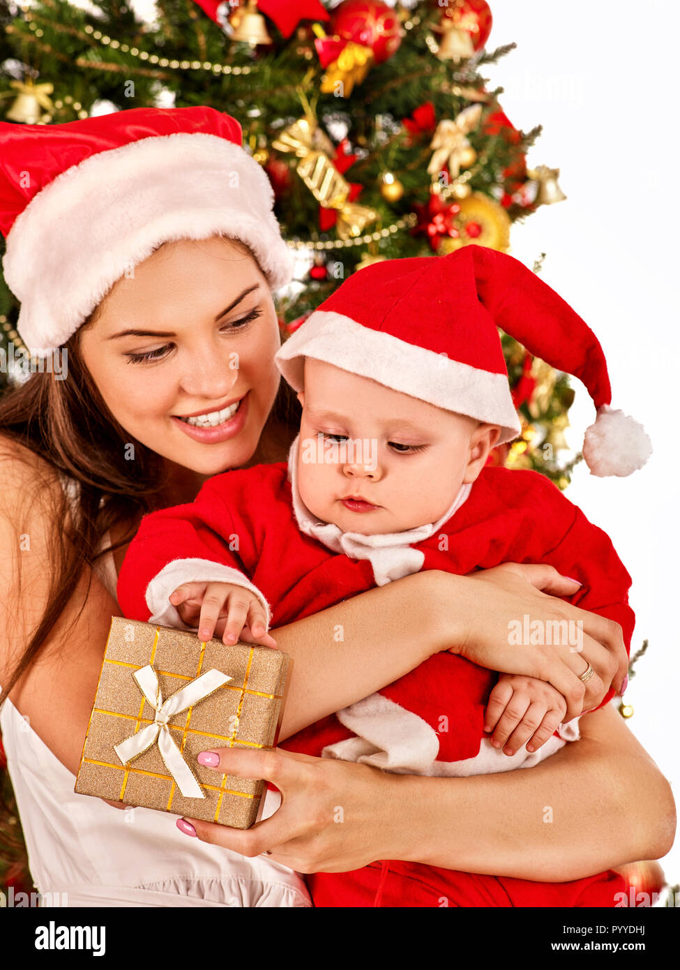 Family sitting around christmas tree hi-res stock photography and ...