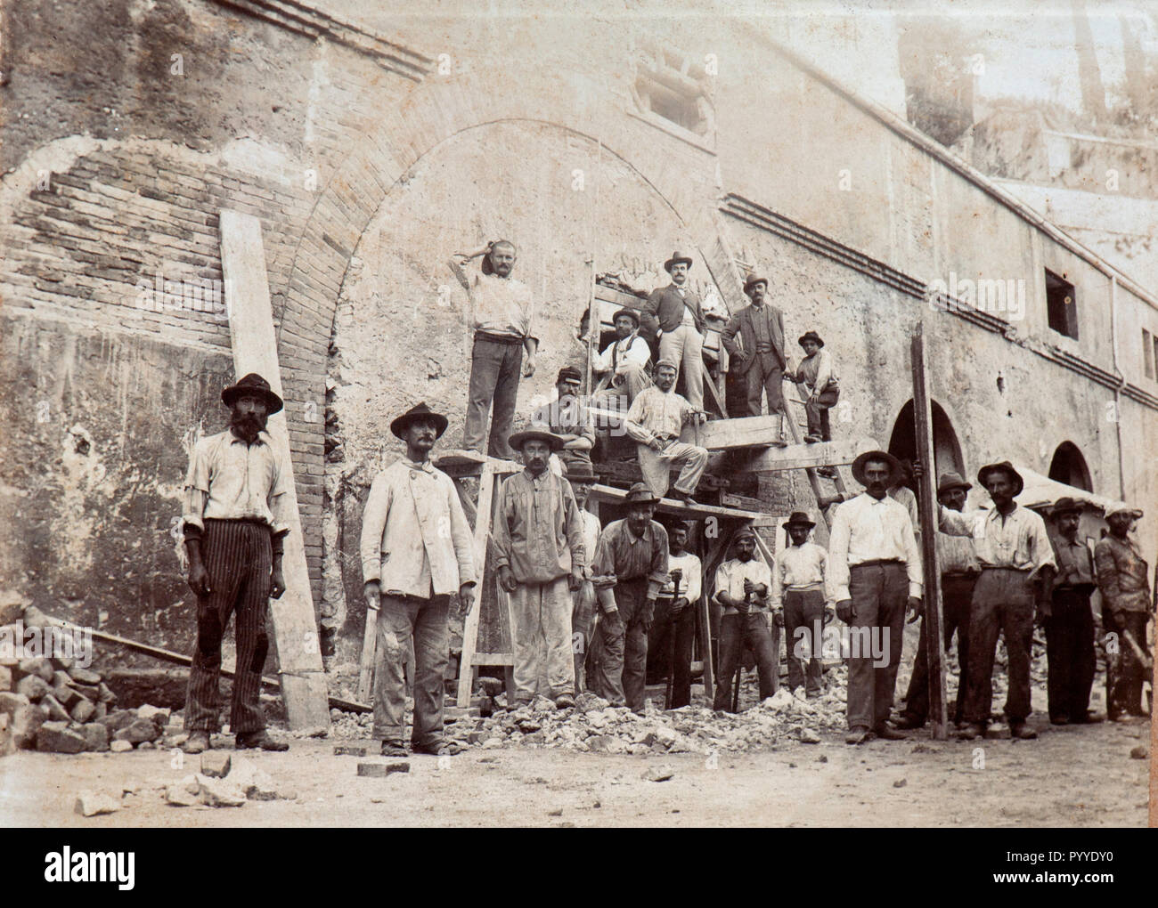 Unknown italian workers posing for the photographer in an unknown ...