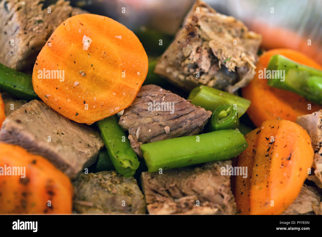 Beef stew with vegetables close up view Stock Photo - Alamy