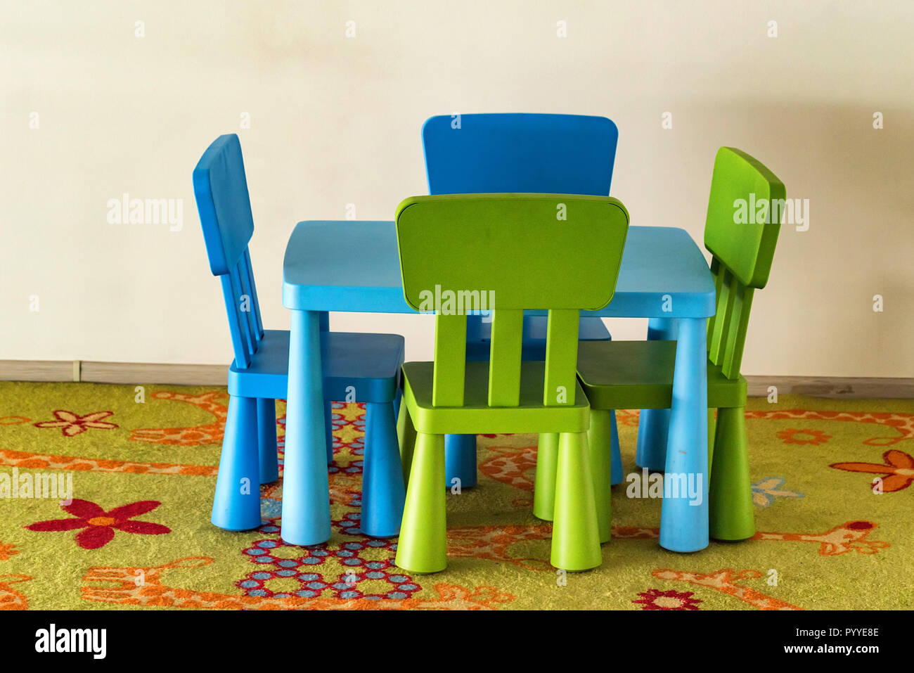 Small colorful table and chairs for children Stock Photo - Alamy