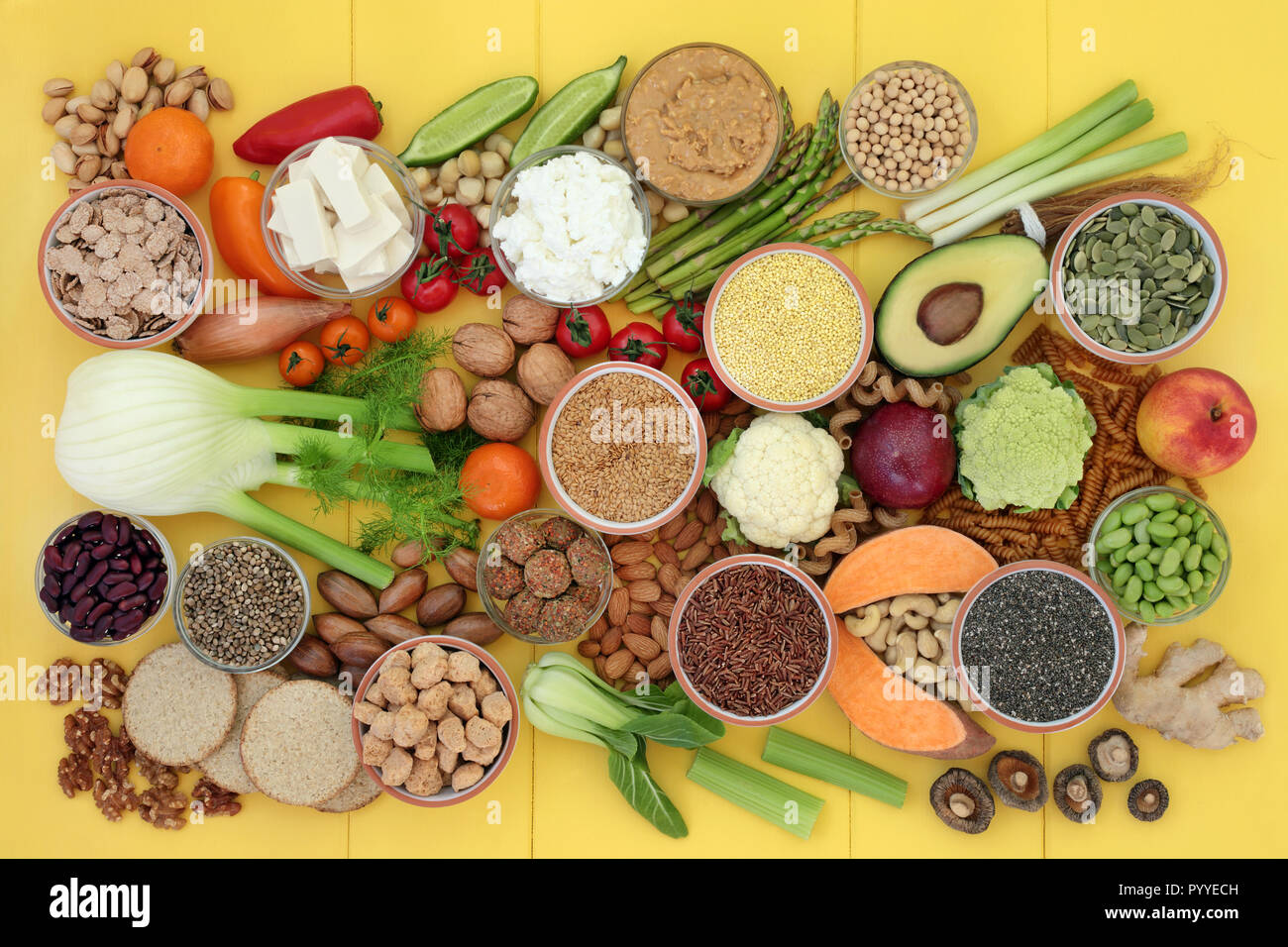 Healthy food for vegans with grains, peanut butter, almond yoghurt ...