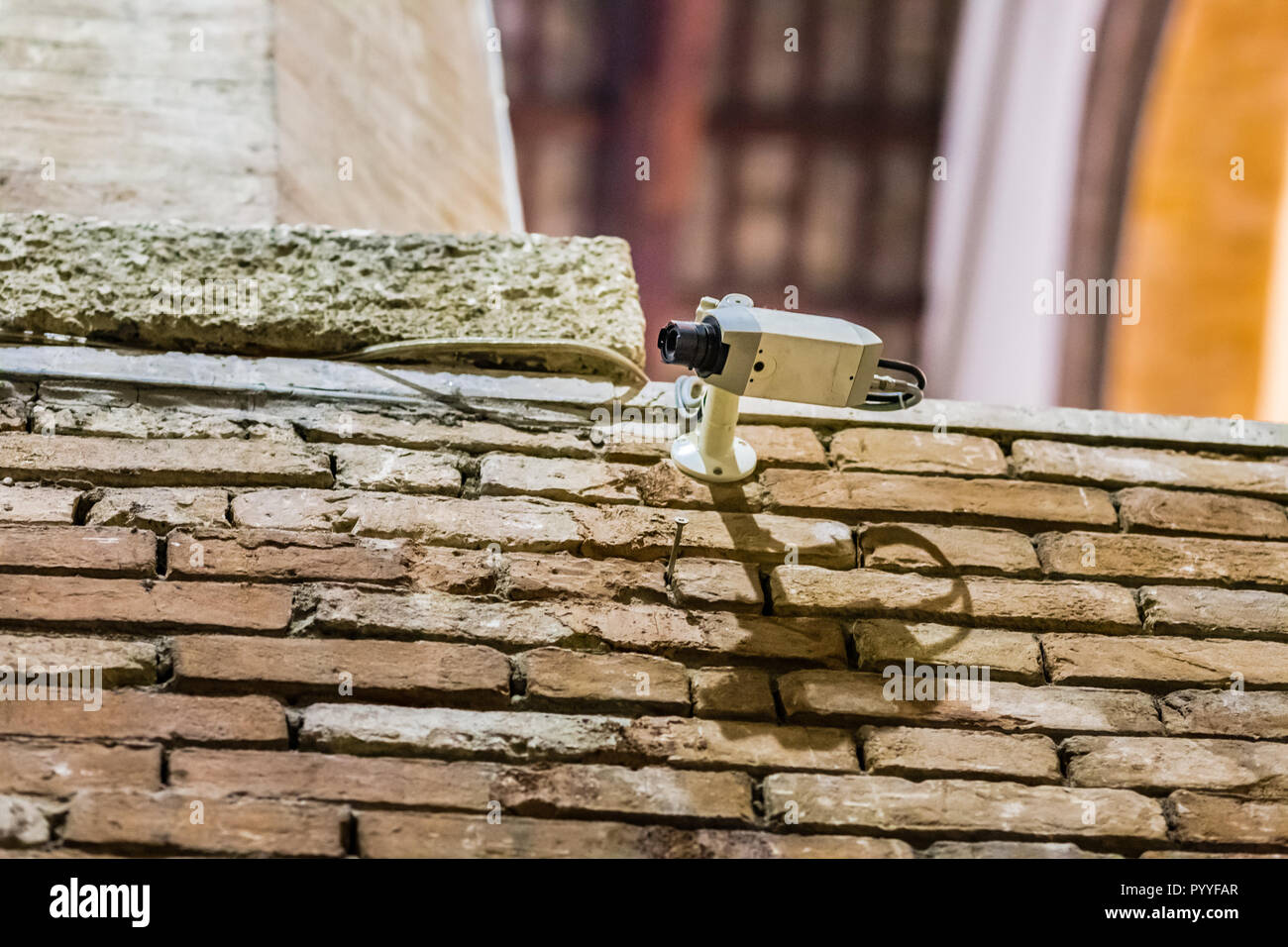 Modern surveillance camera on old brick wall Stock Photo - Alamy