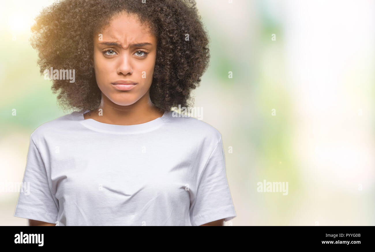 Young afro american woman over isolated background depressed and worry ...