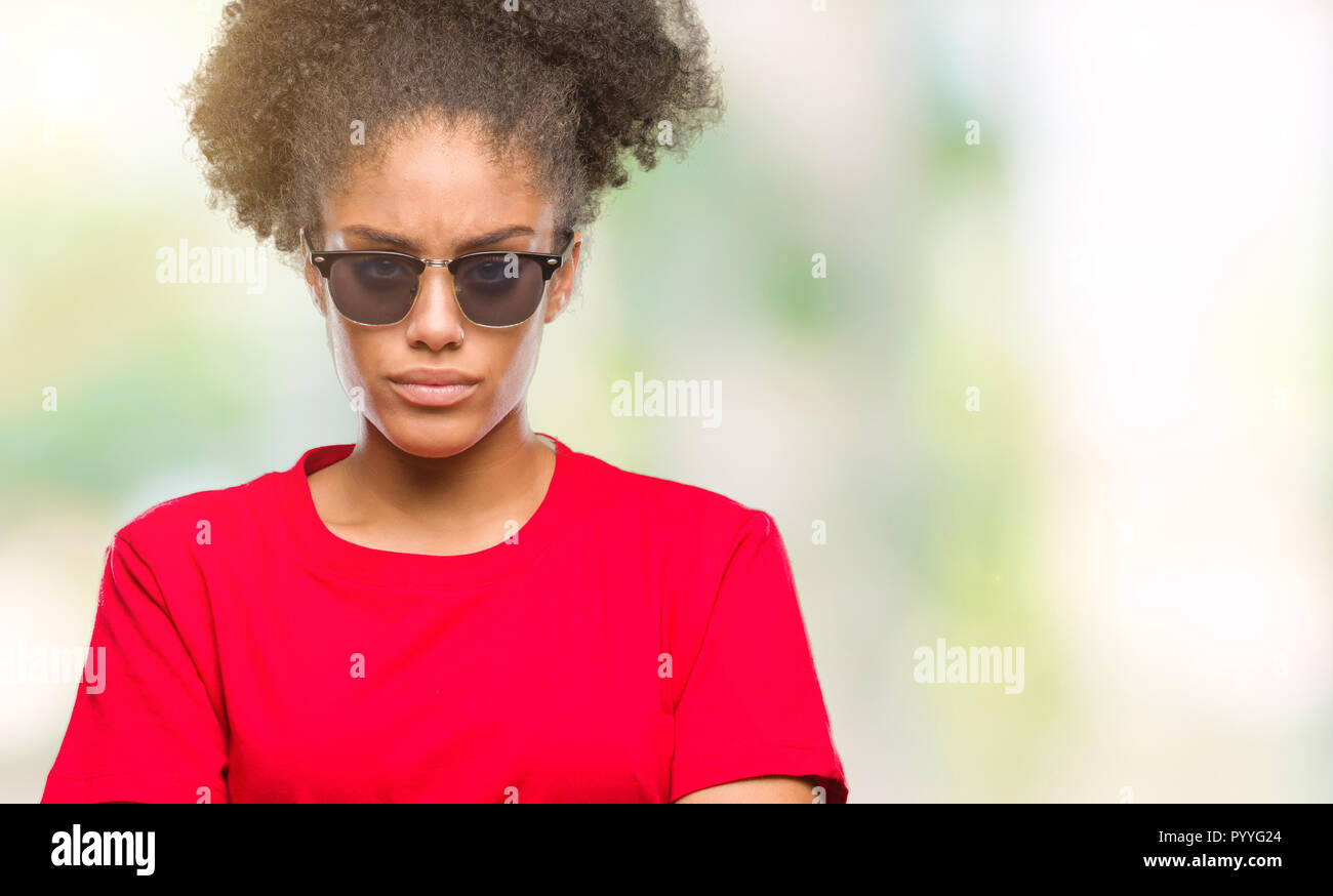 Young afro american woman wearing sunglasses over isolated background ...