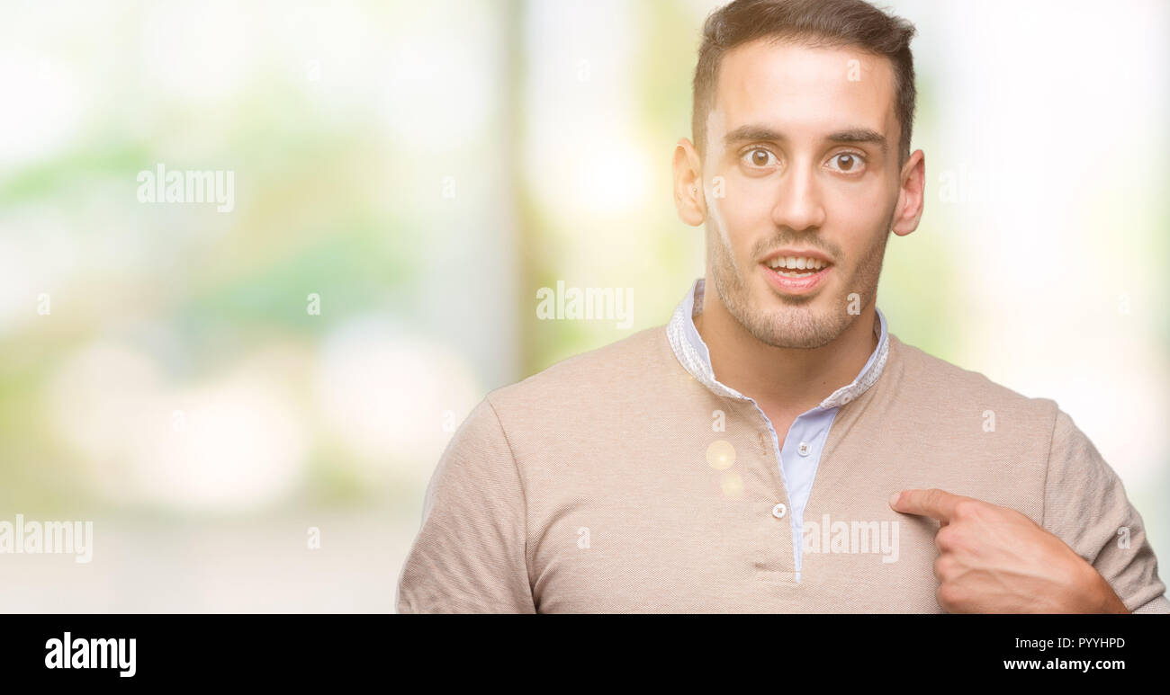 Handsome young man with surprise face pointing finger to himself Stock ...