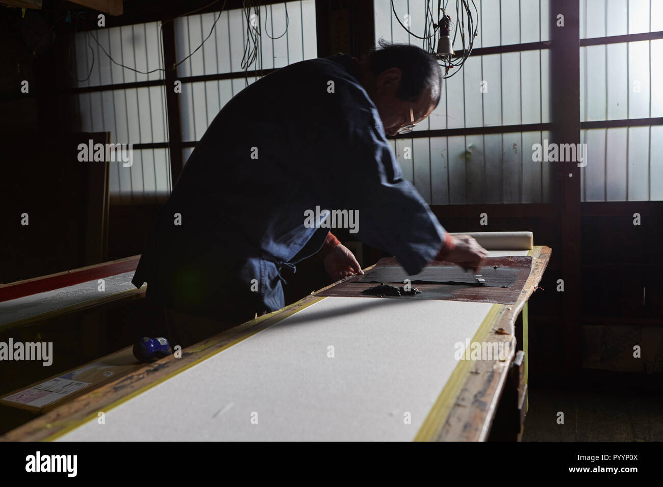 Japanese artisan working in the studio Stock Photo - Alamy