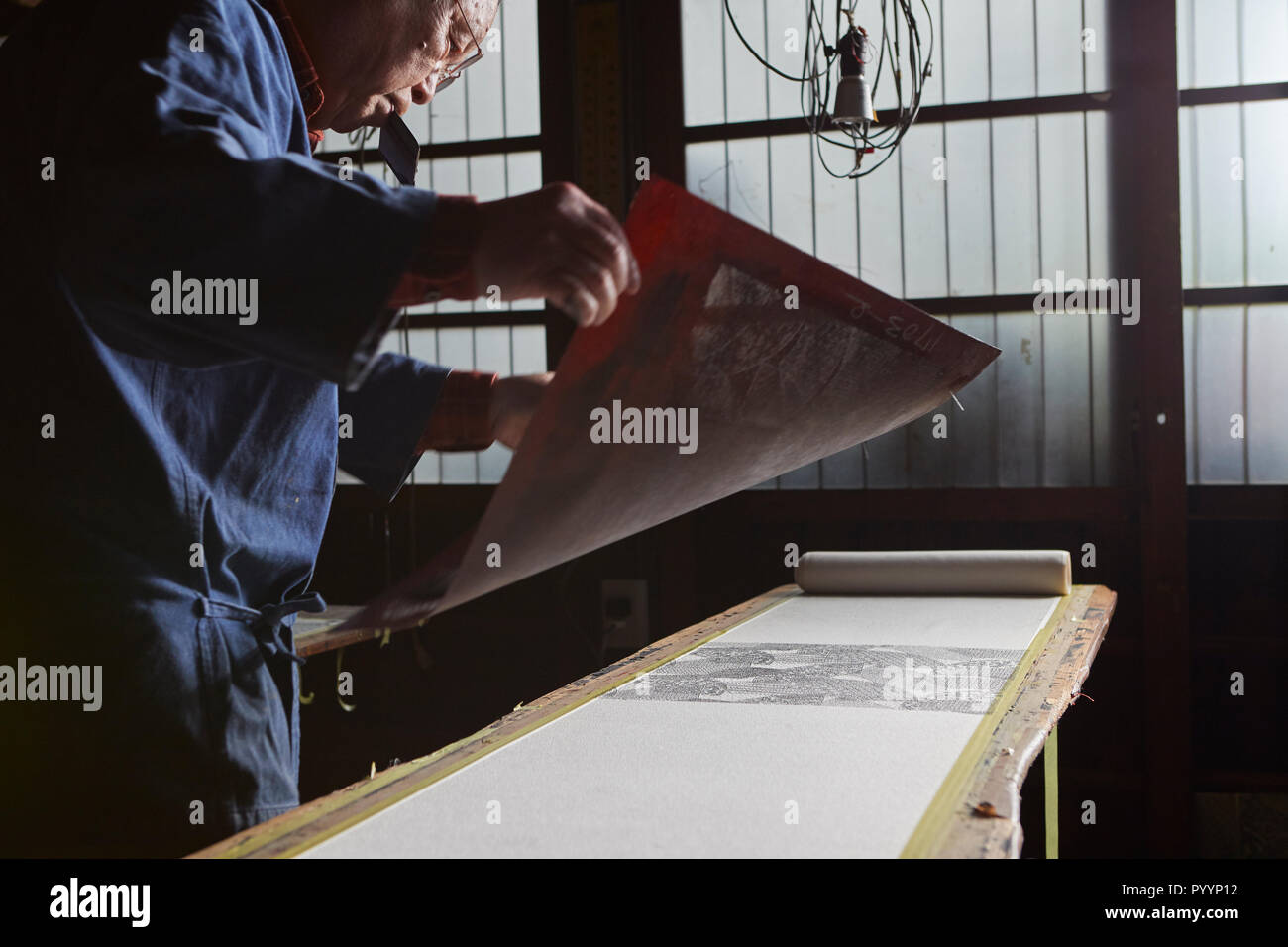 Japanese artisan working in the studio Stock Photo - Alamy