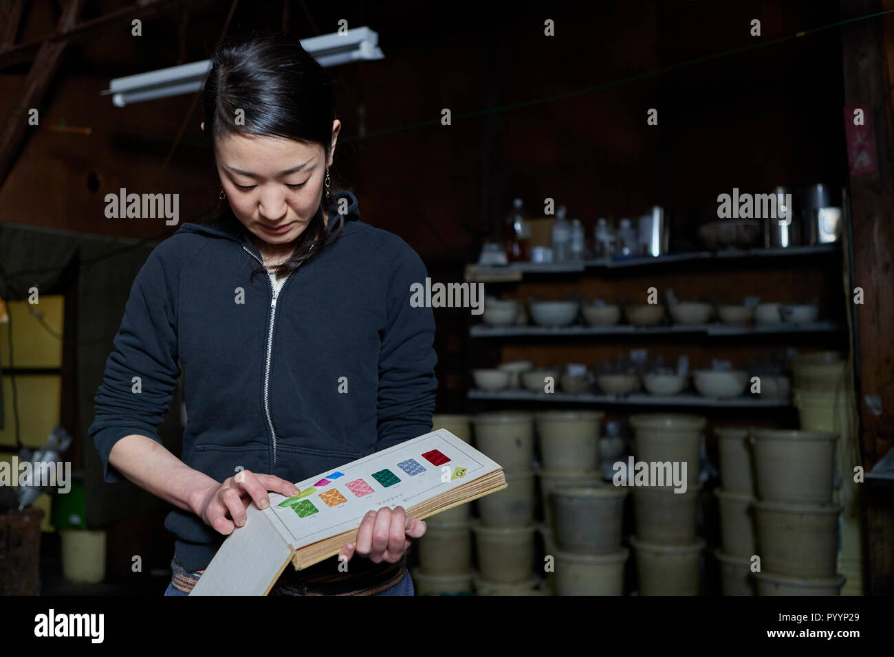 Japanese artisan working in the studio Stock Photo - Alamy