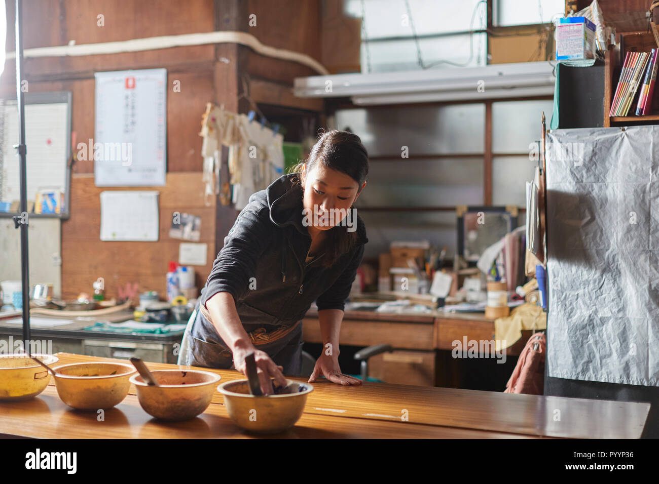 Japanese artisan working in the studio Stock Photo - Alamy