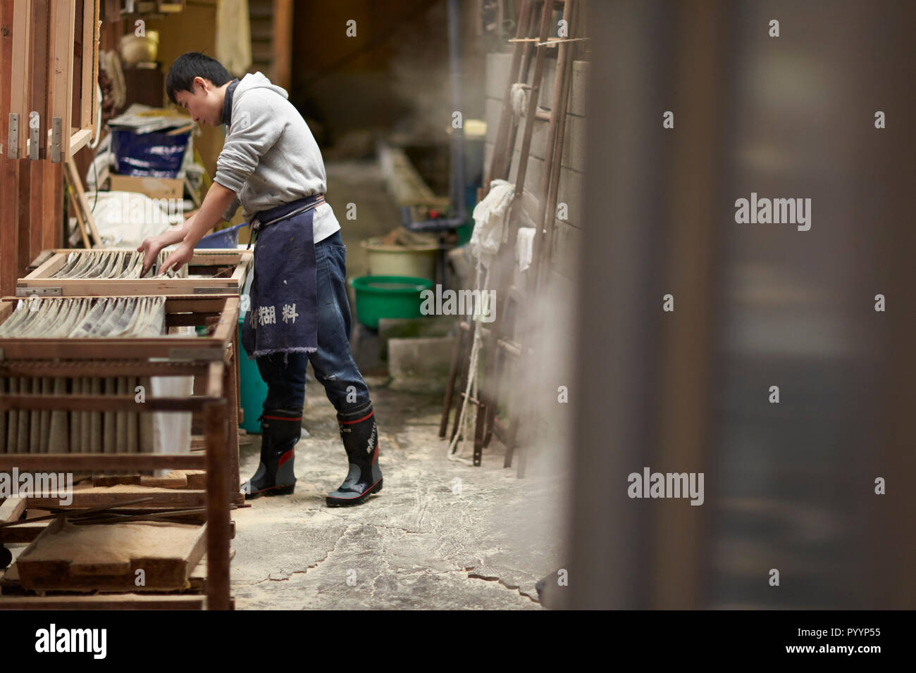 Japanese artisan working in the studio Stock Photo - Alamy