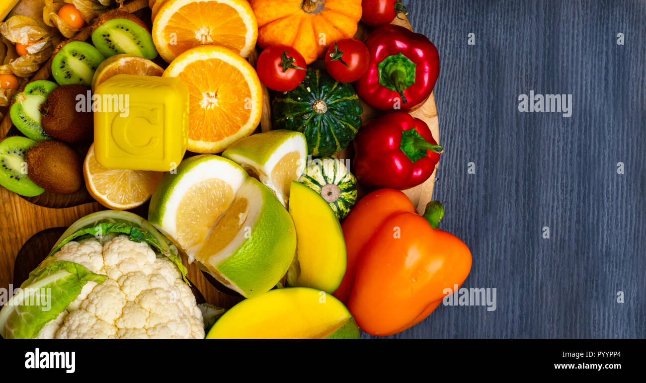 Foods High in vitamin C on a wooden board. Healthy eating. Dieting ...