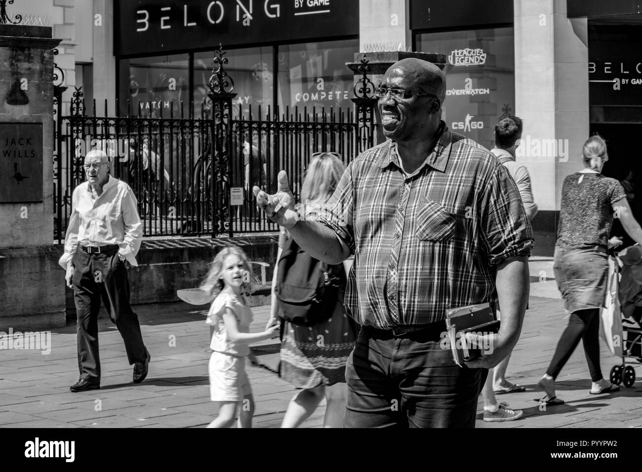 Tony is explaining why to believe in god Stock Photo - Alamy