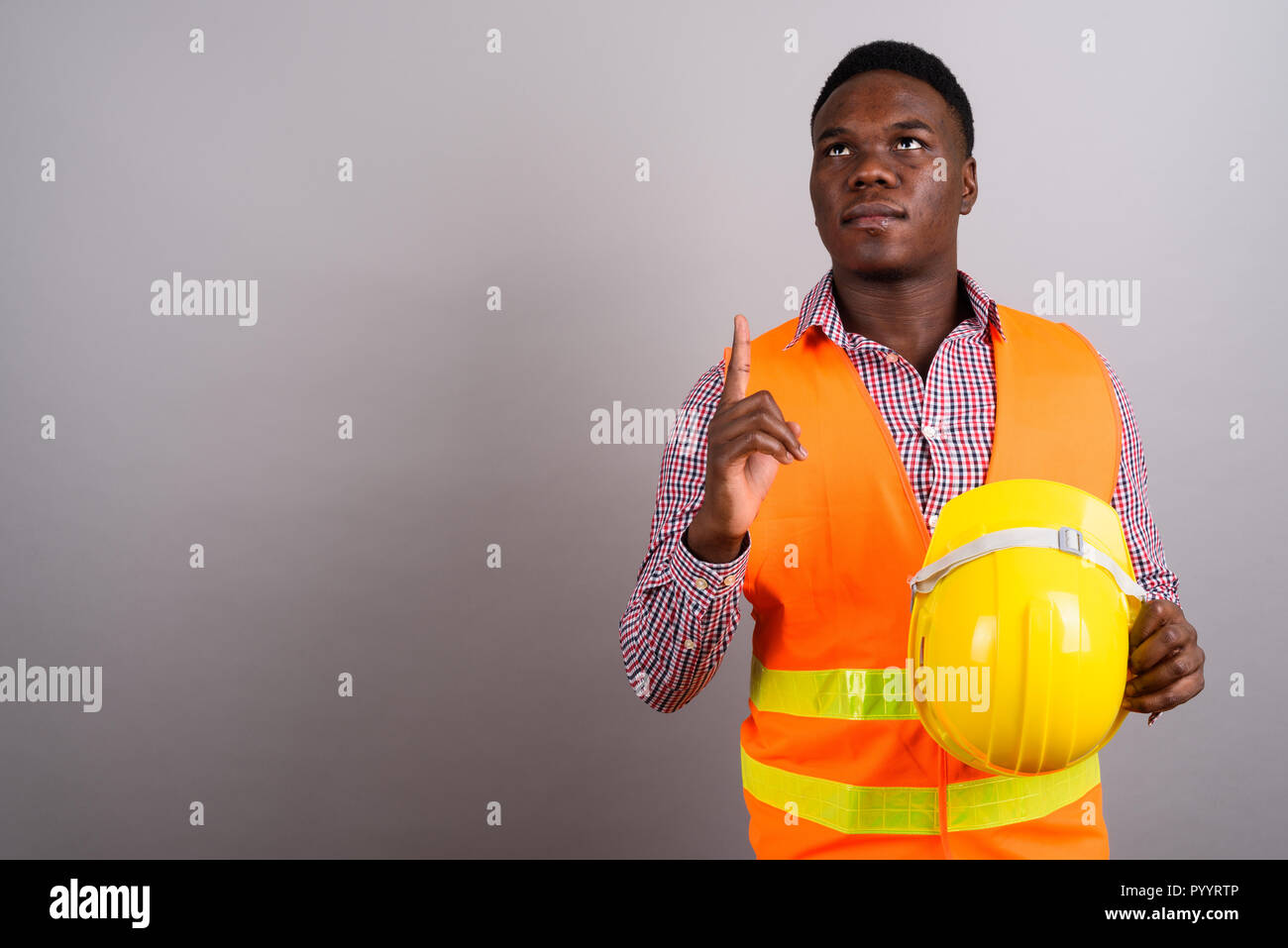 Young African man construction worker against white background Stock ...