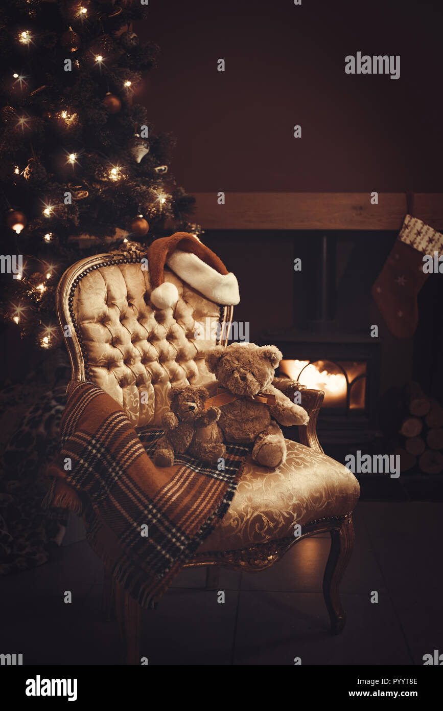 Festive Christmas Eve by a roaring log fire Stock Photo - Alamy