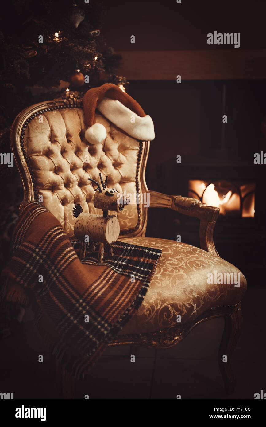 Christmas by roaring log fire Stock Photo - Alamy