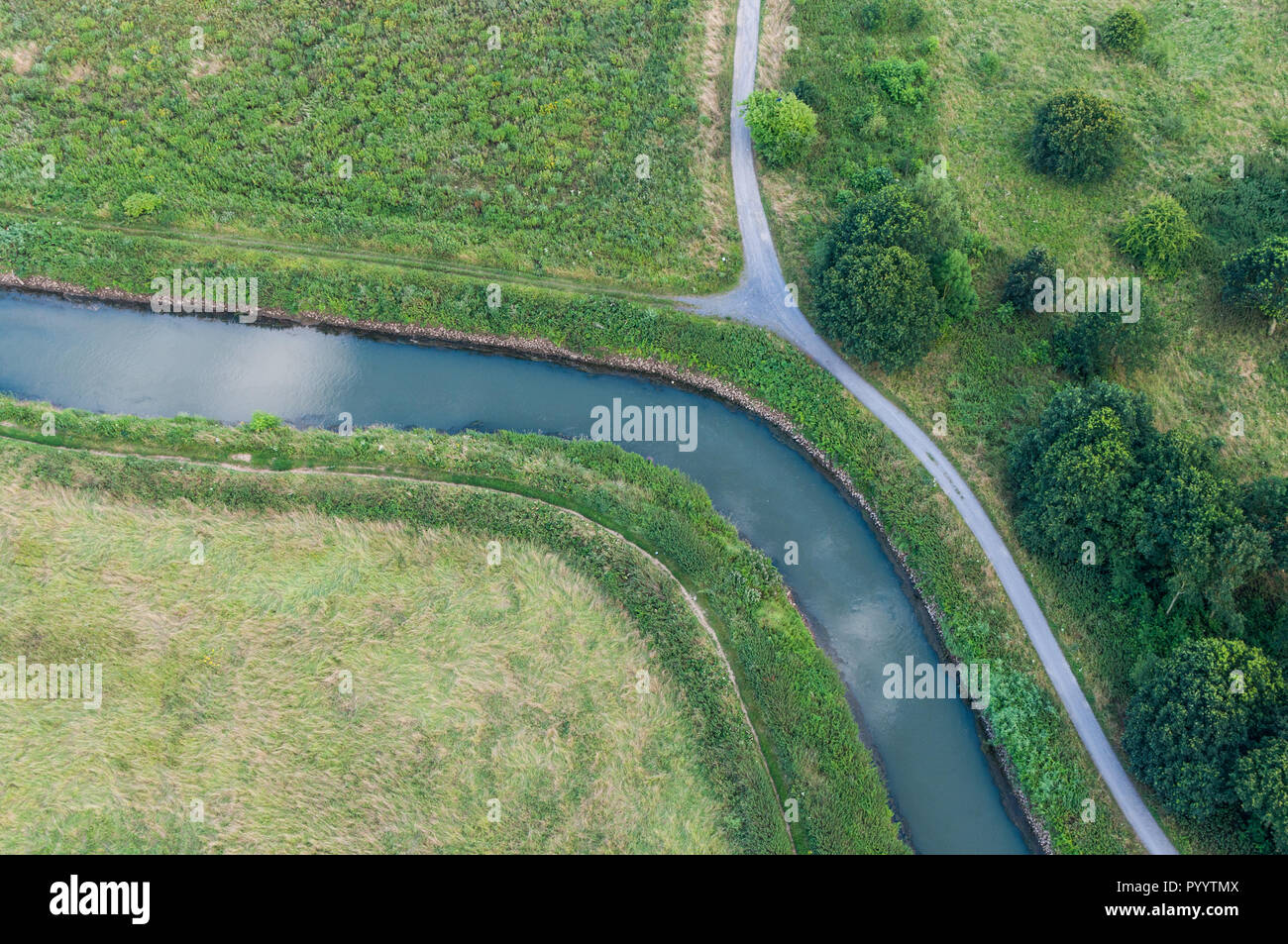 Aerial image of clouds reflecting in Demer river at the village of ...