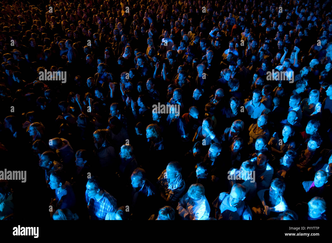 Aerial image of colorful stage light falling on the public during a ...