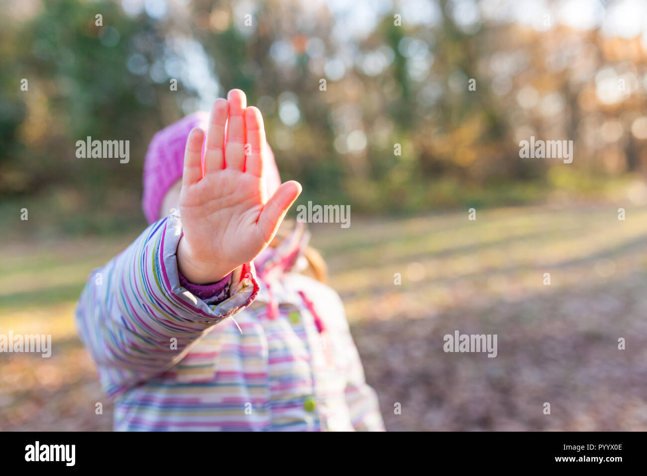 Portrait of young caucasian girl showing stop hand sign in front of her ...
