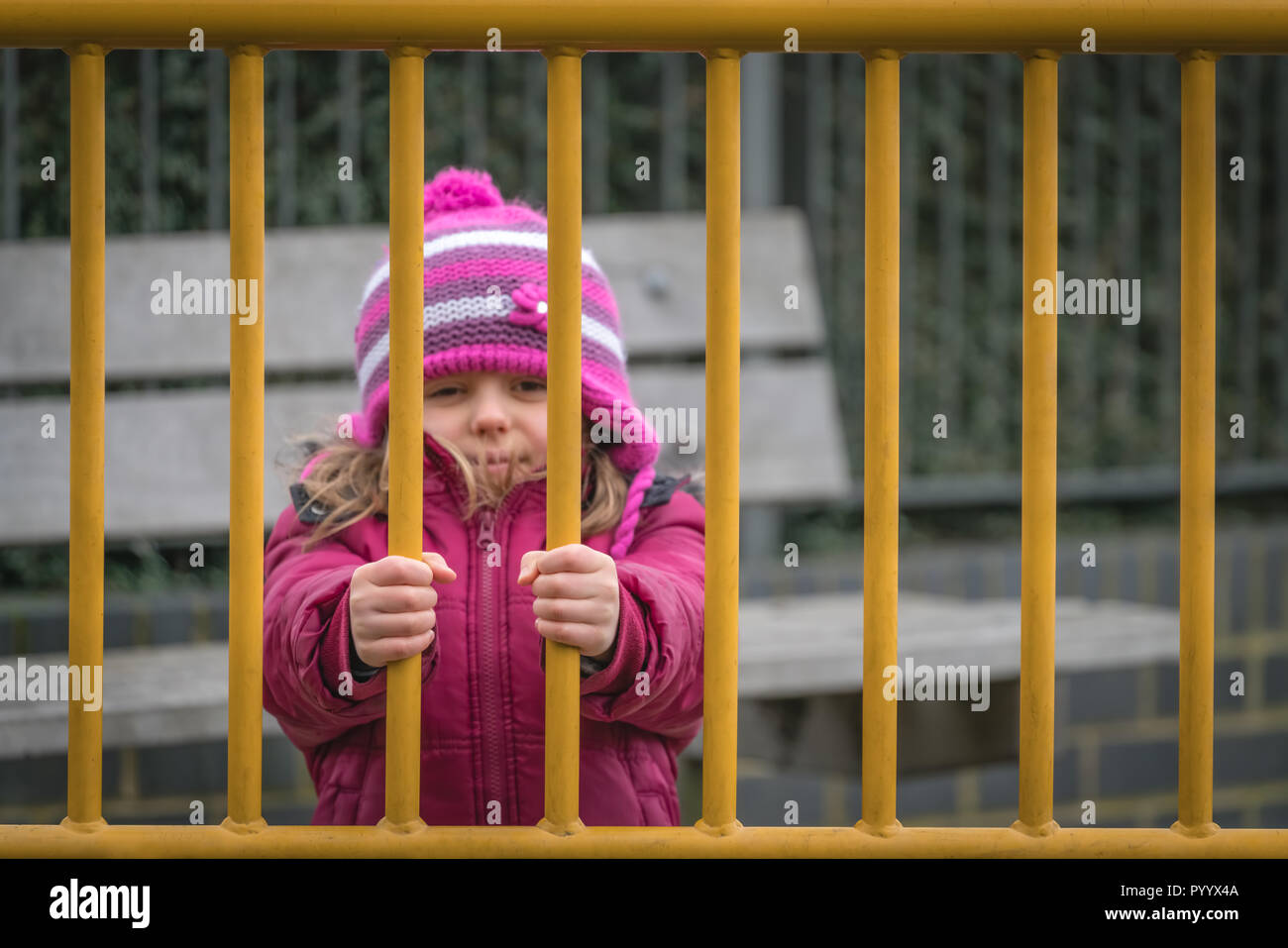 Little cute Caucasian girl dressed in pink hat and jacket standing ...