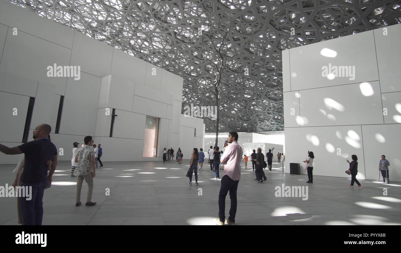 Interior of the new Louvre Museum in Abu Dhabi showing reflections of ...
