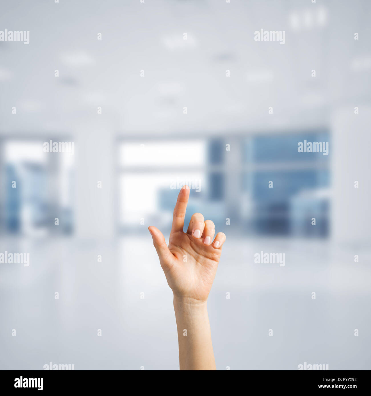 Choosing gesture of person in elegant modern interior in sunshine light ...