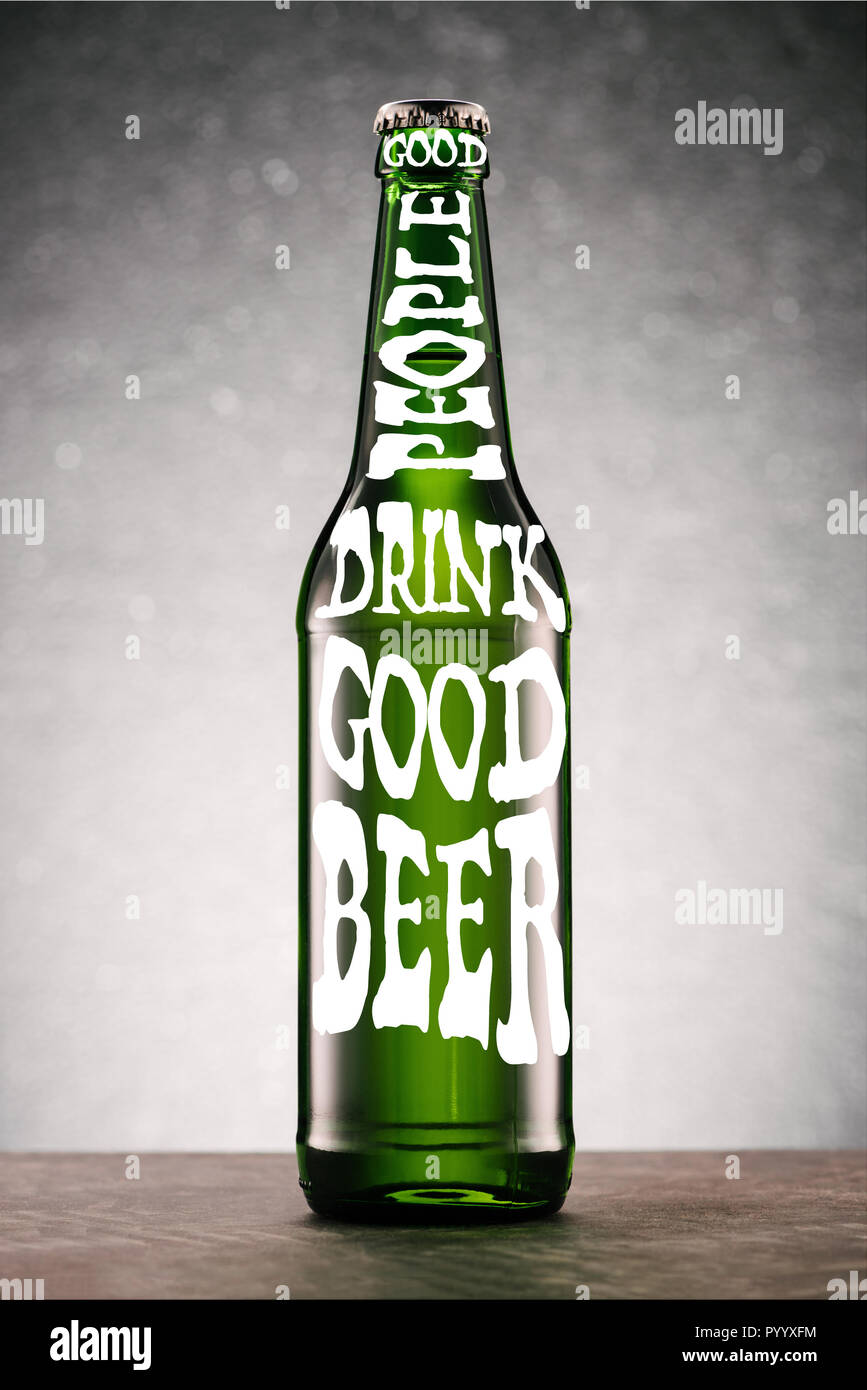 beer bottle on tabletop on grey background with "good people drink good ...