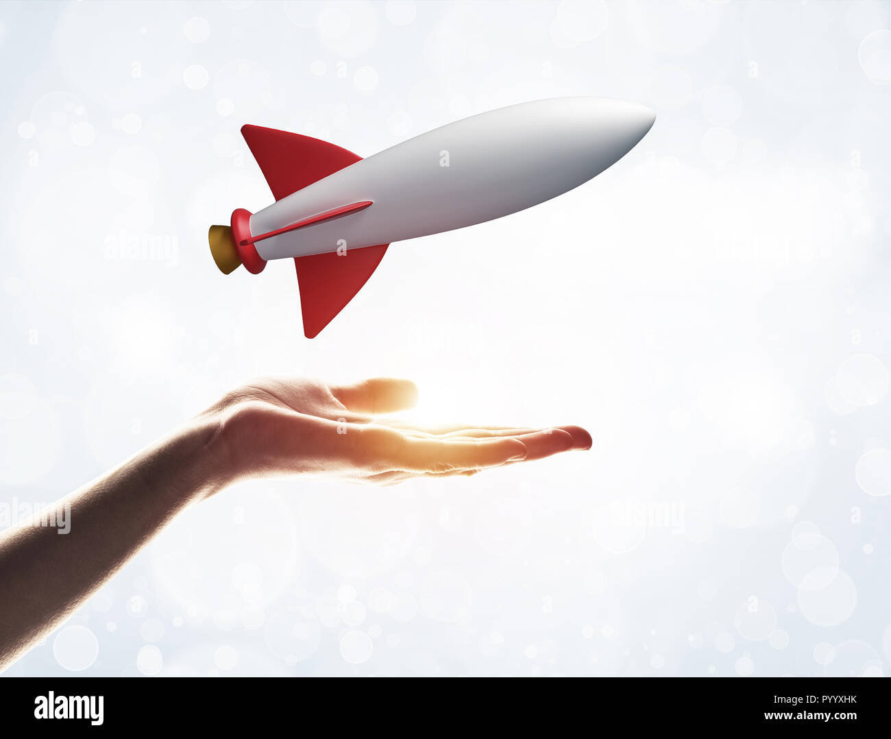 Rocket in hand as symbol for high technologies and science Stock Photo ...