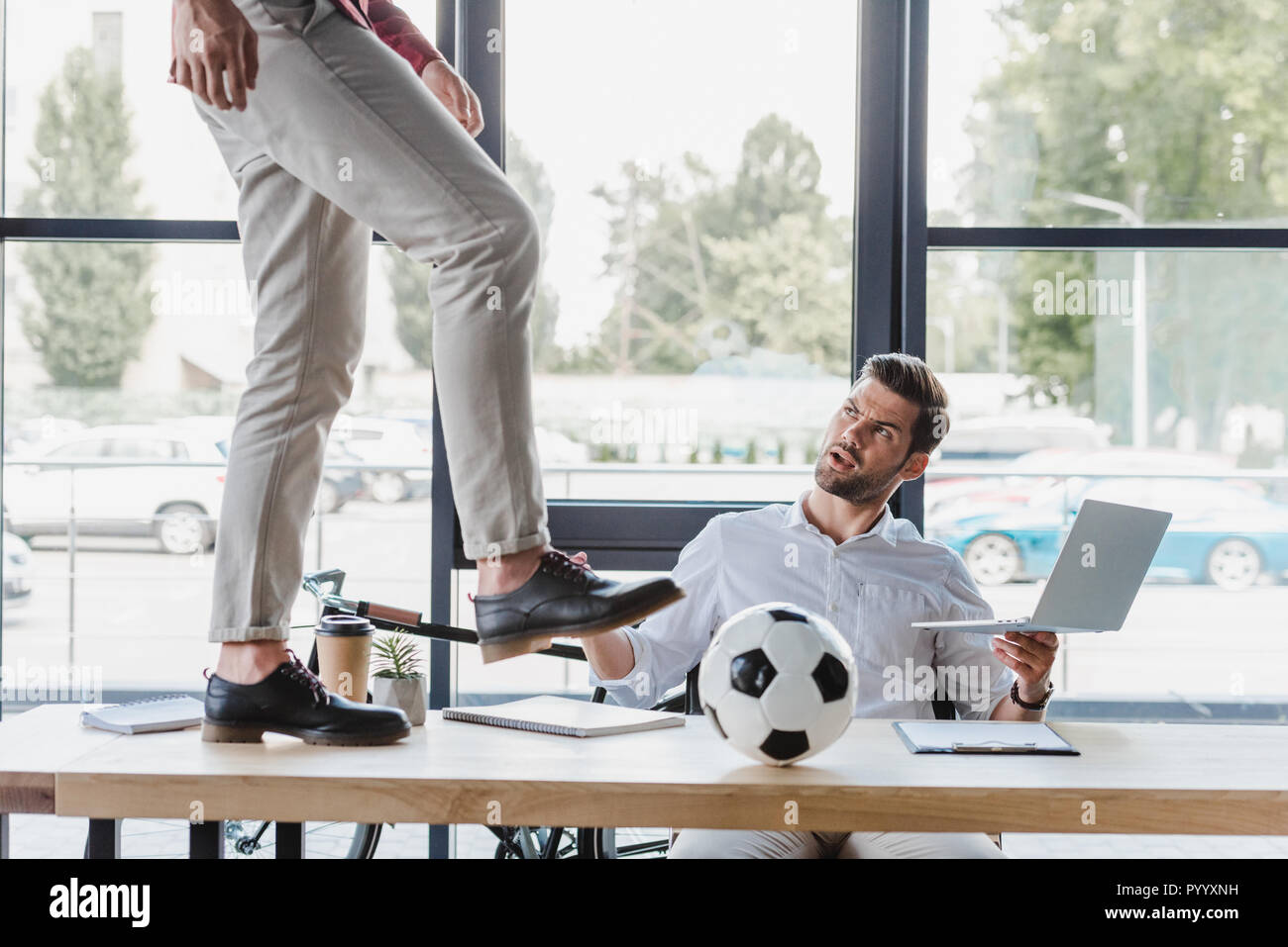 Kicking soccer ball hi-res stock photography and images - Alamy