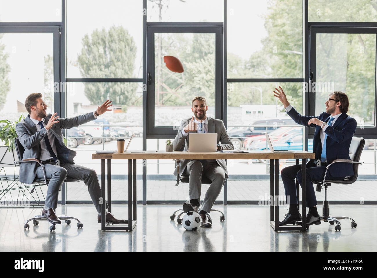 Office workers playing football hi-res stock photography and images - Alamy
