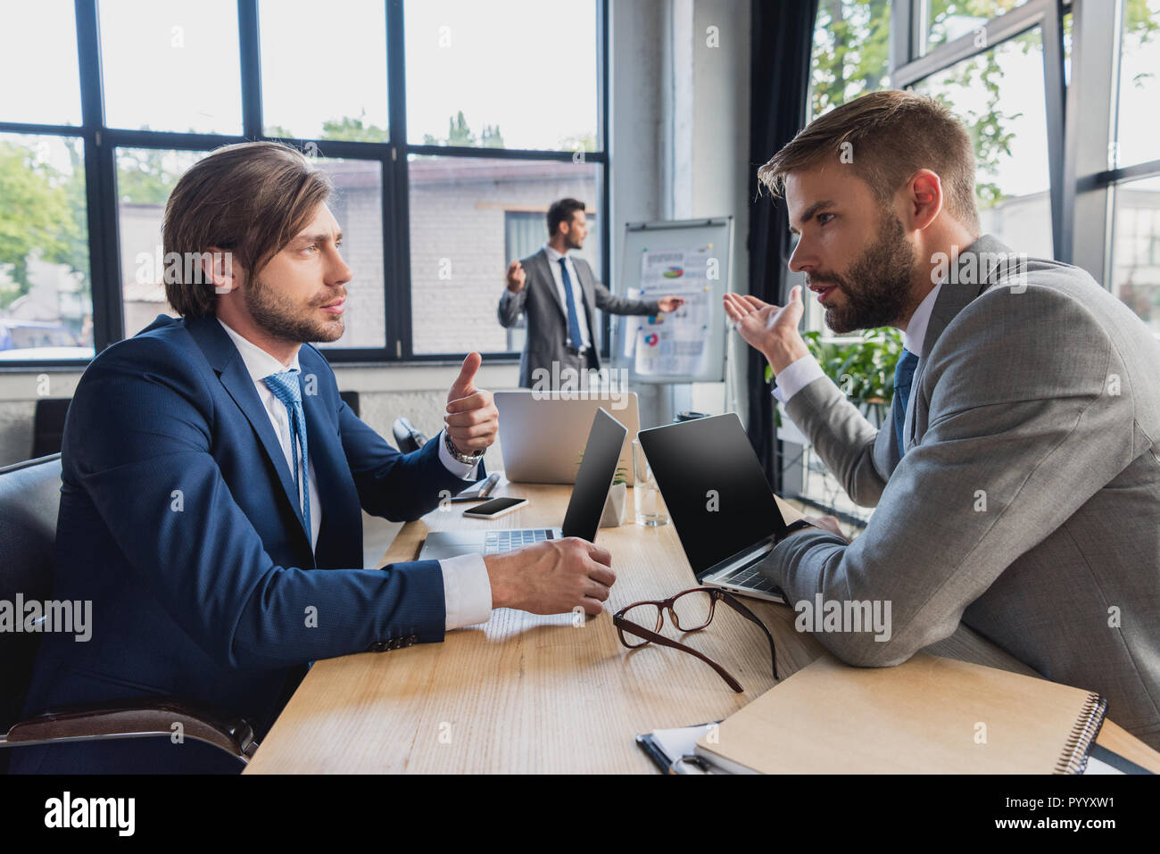 Young project managers sitting hi-res stock photography and images - Alamy