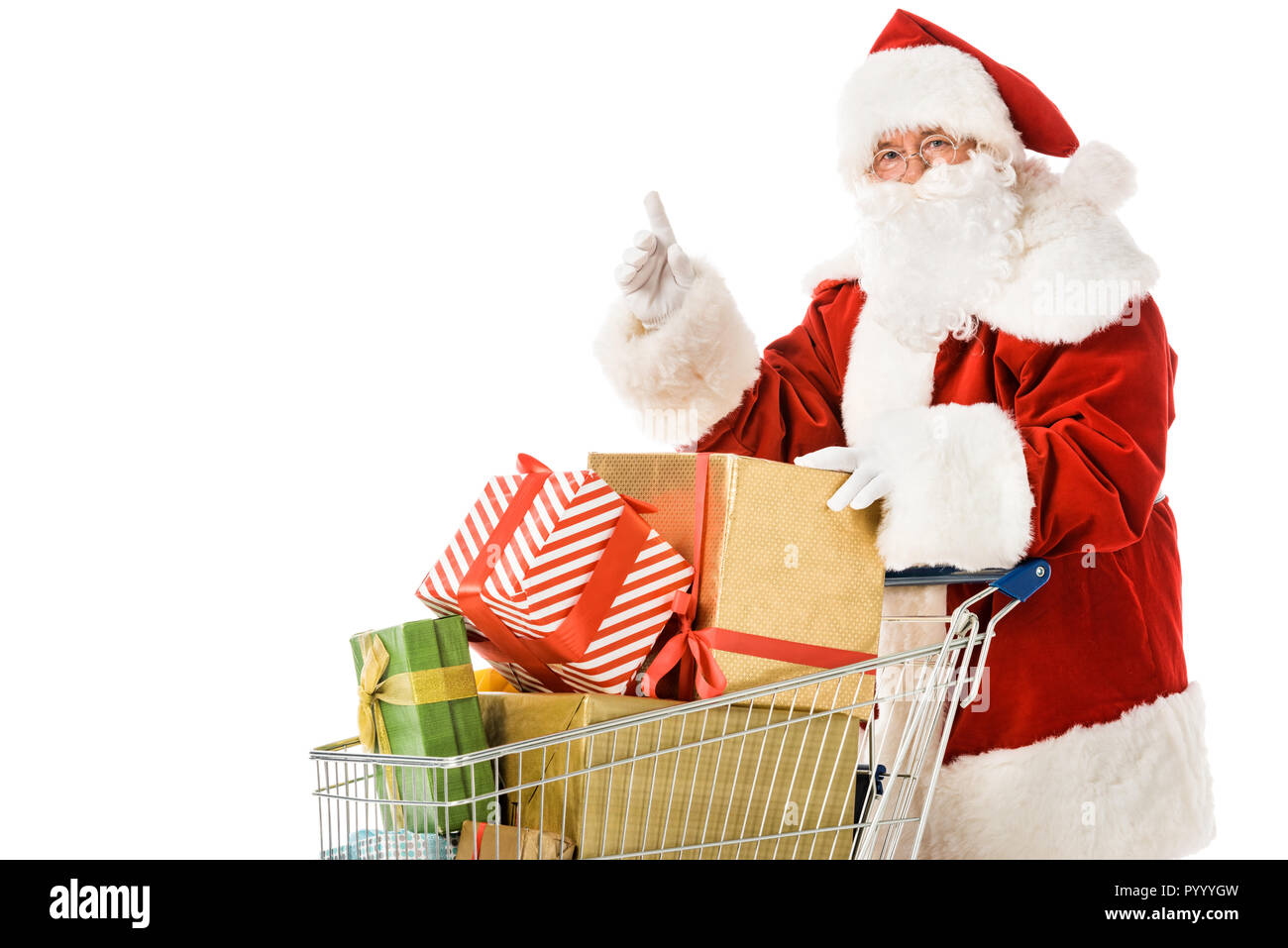 santa claus with shopping cart full of gift boxes pointing up isolated ...