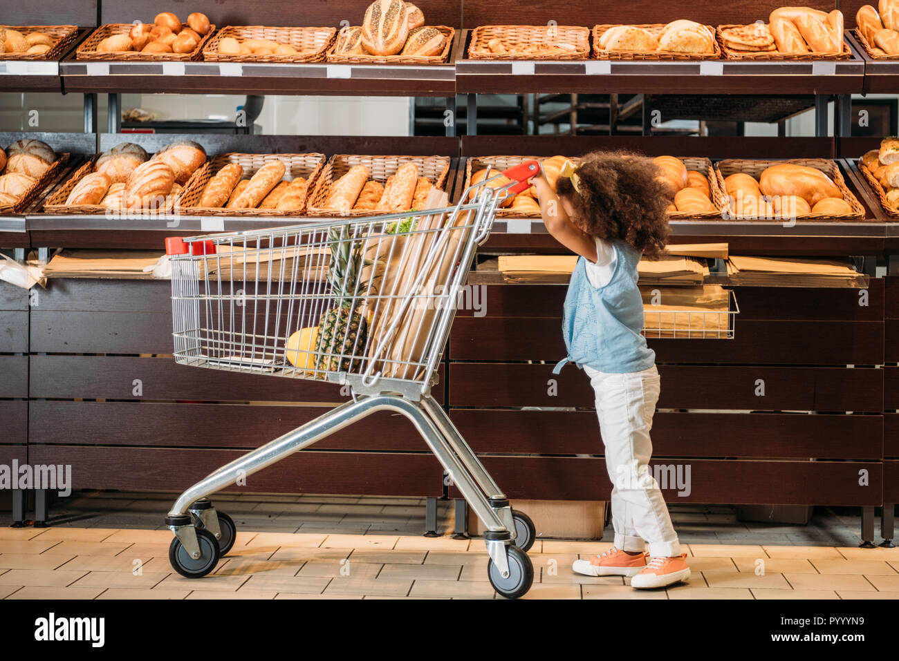 Child carrying trolley hi-res stock photography and images - Alamy