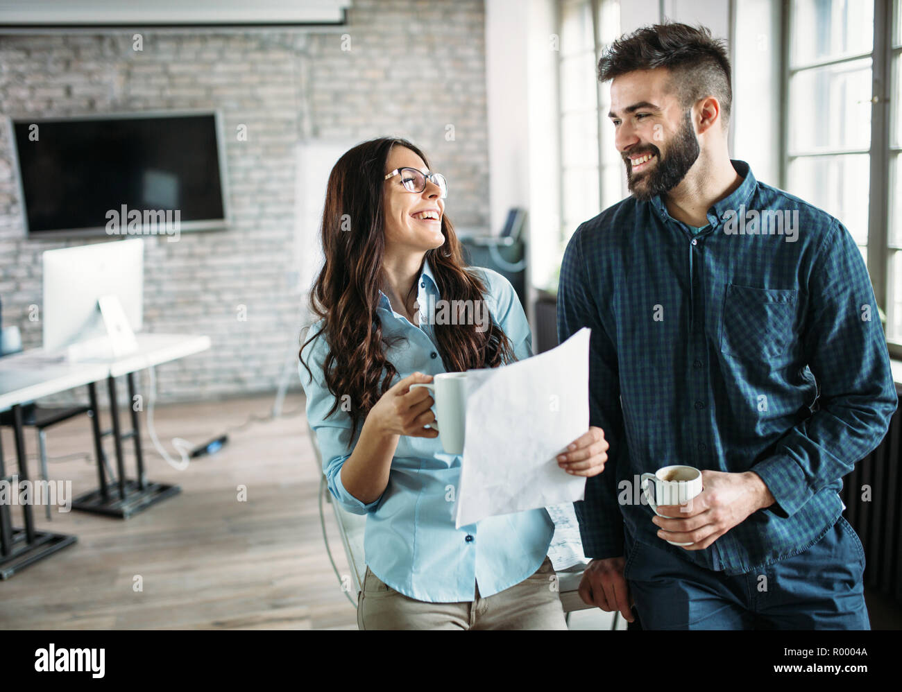 Portrait of architects having discussion in office Stock Photo - Alamy