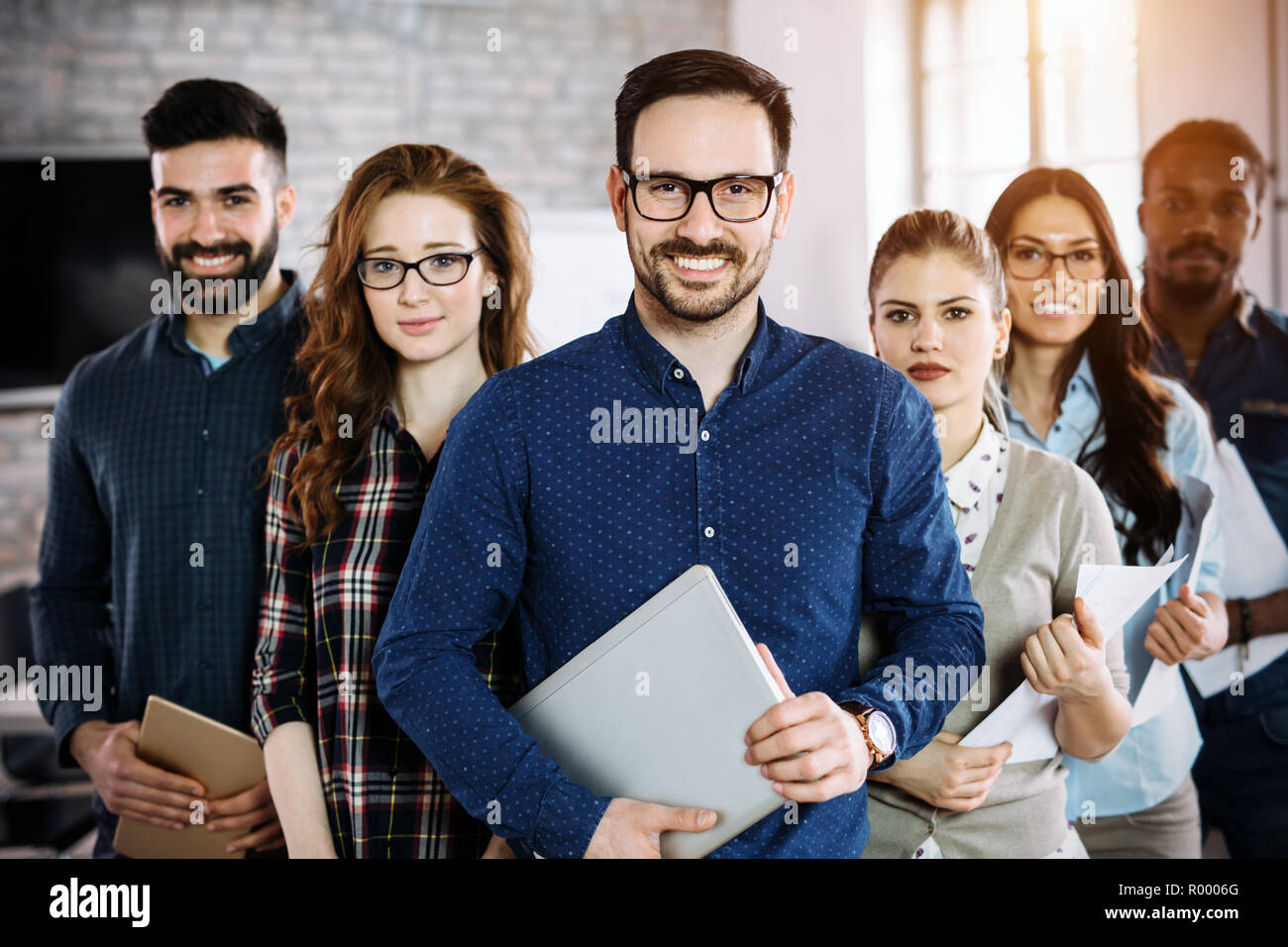 Successful smiling business team hi-res stock photography and images - Alamy