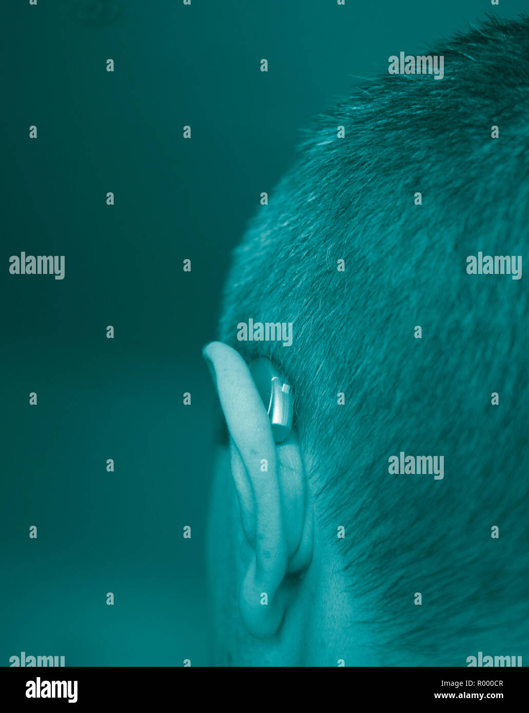 Modern compact in the ear digital audiophone hearing aid in the ear of ...