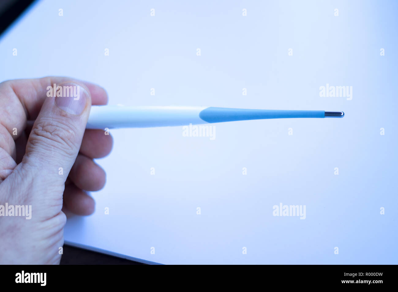 Digital medical thermometer instrument used by doctor or nurse to ...
