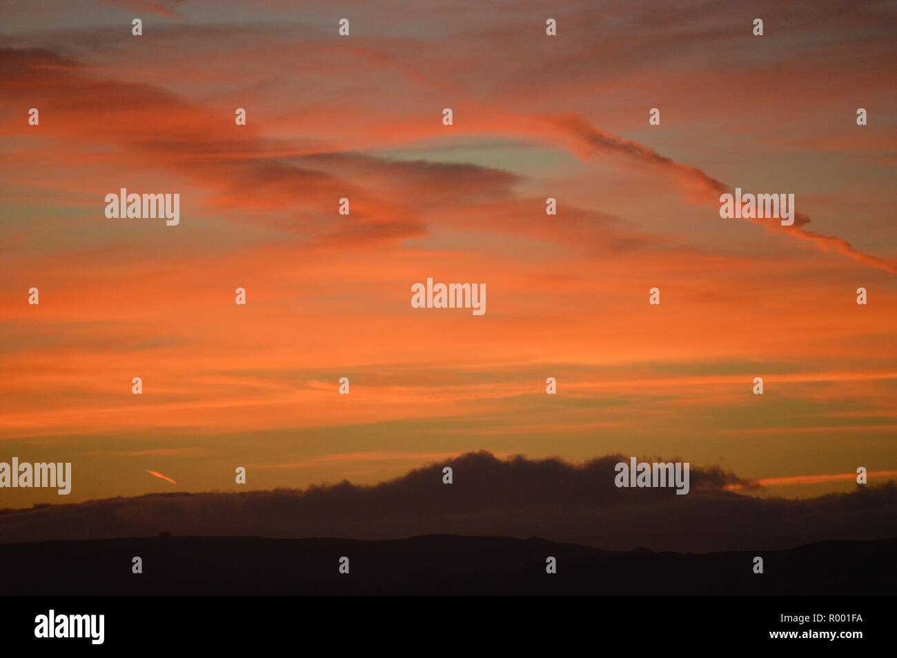 Evening sun light in the sky Stock Photo - Alamy