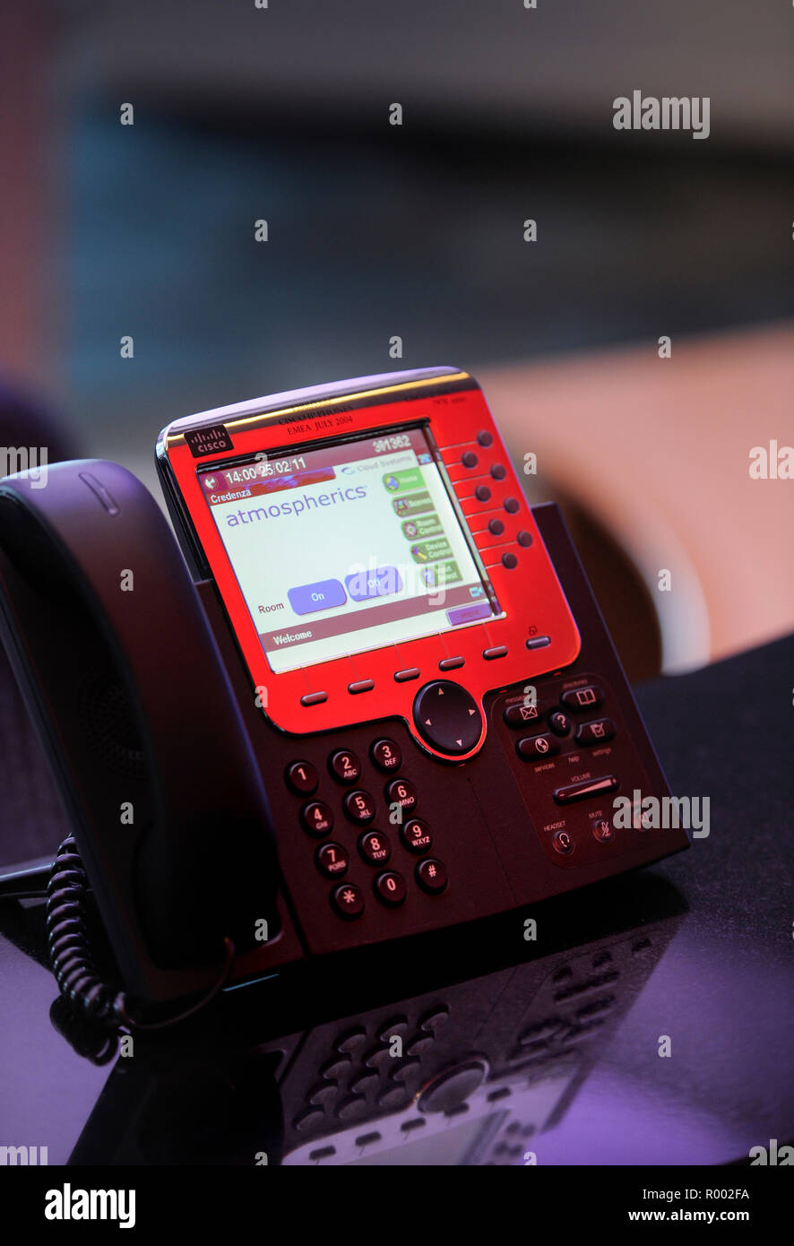 A telephone with small display screen on a desk Stock Photo - Alamy